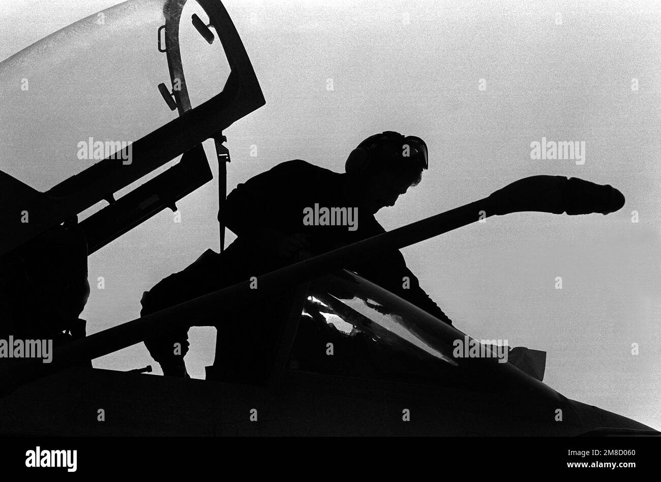 A member of Attack Squadron 122 (VA-122) cleans the windscreen of an A ...