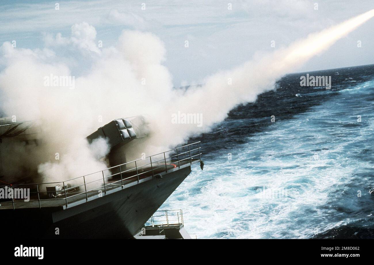 A trainer missile is launched from a Mark 29 NATO Sea Sparrow launcher ...