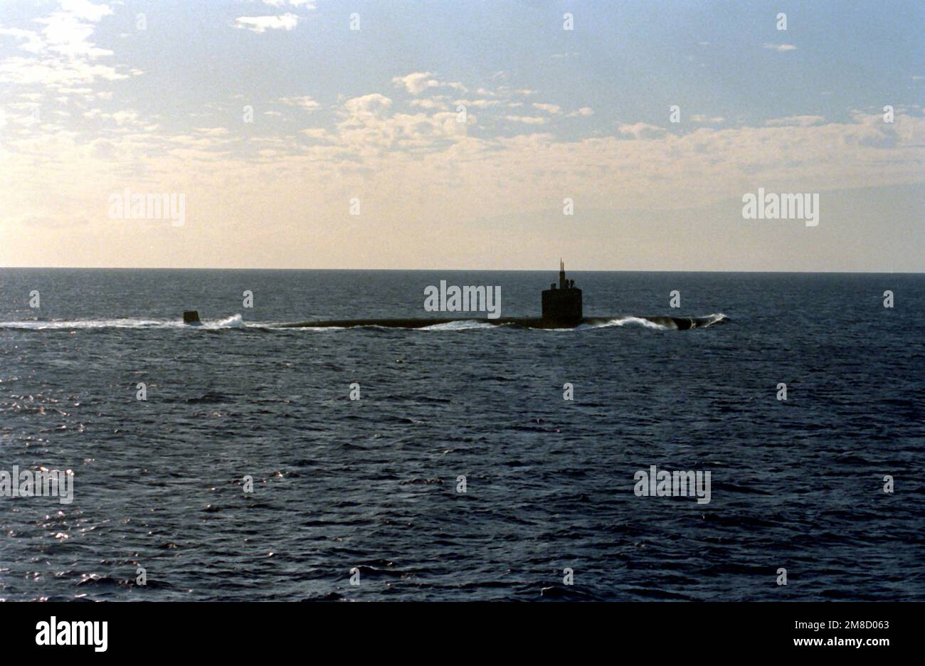A port beam view of the nuclear-powered attack submarine USS OLYMPIA (SSN-717) underway off the ...