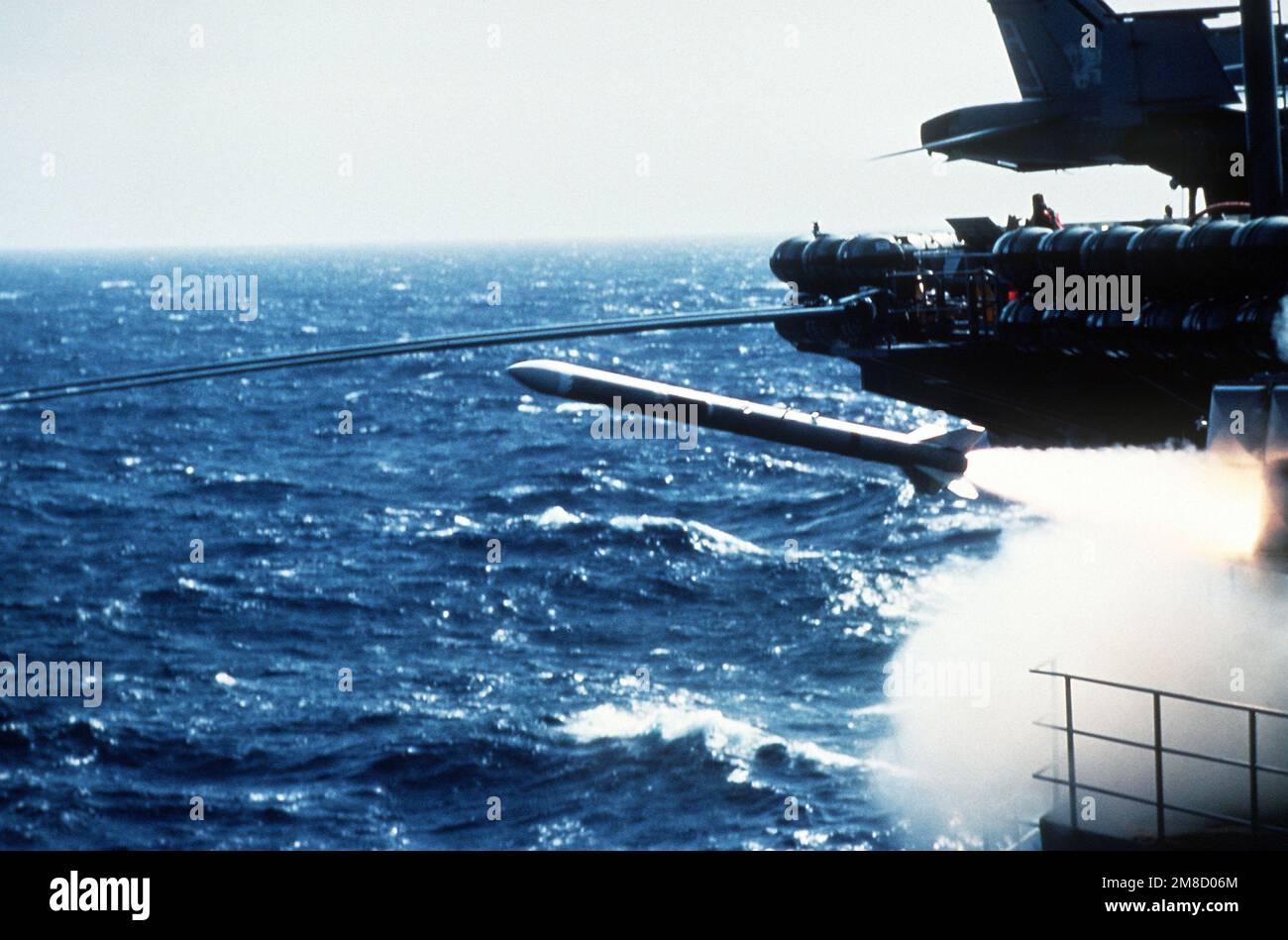 A trainer missile is launched from a Mark 29 NATO Sea Sparrow launcher ...