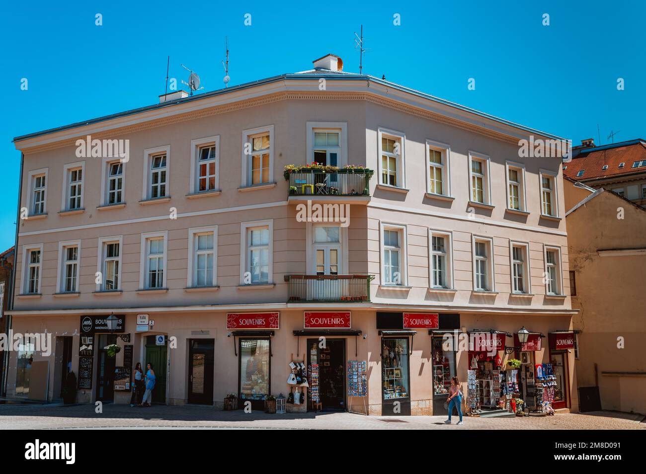 The corner of a classic commercial building with souvenir shops in ...