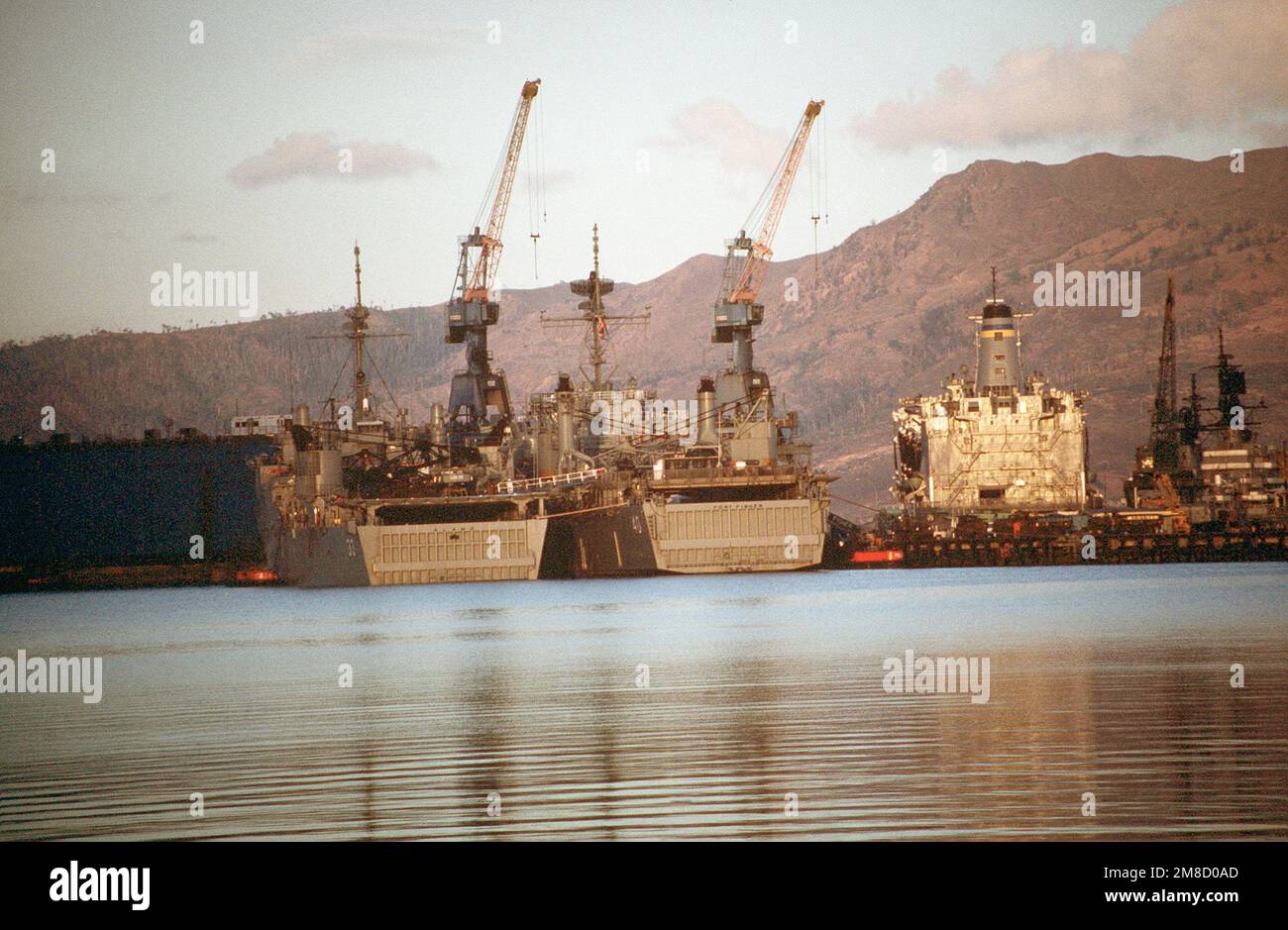 The dock landing ships USS ALAMO (LSD 33), left, and USS FORT FISHER ...