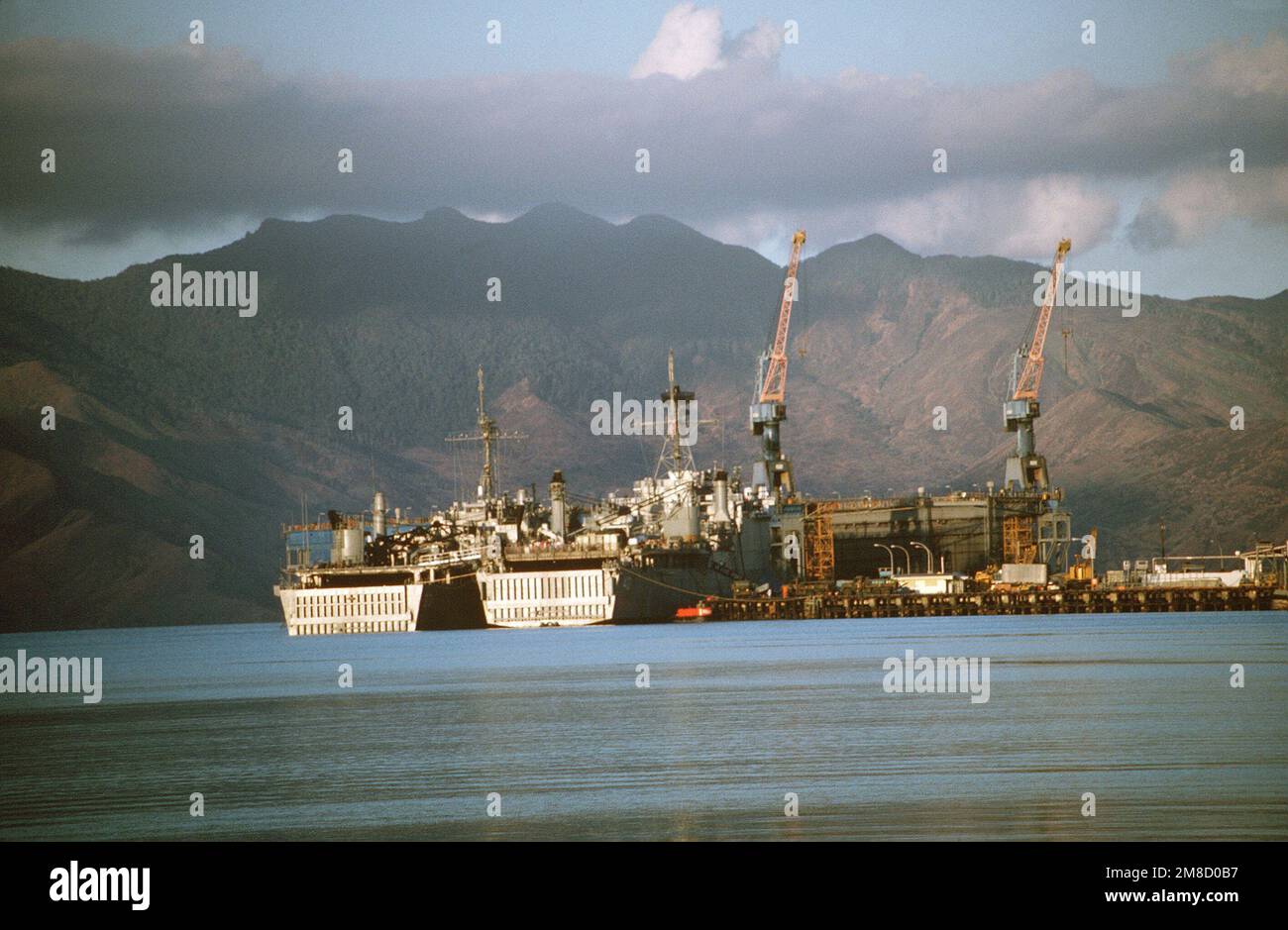 The dock landing ships USS ALAMO (LSD 33), left, and USS FORT FISHER ...