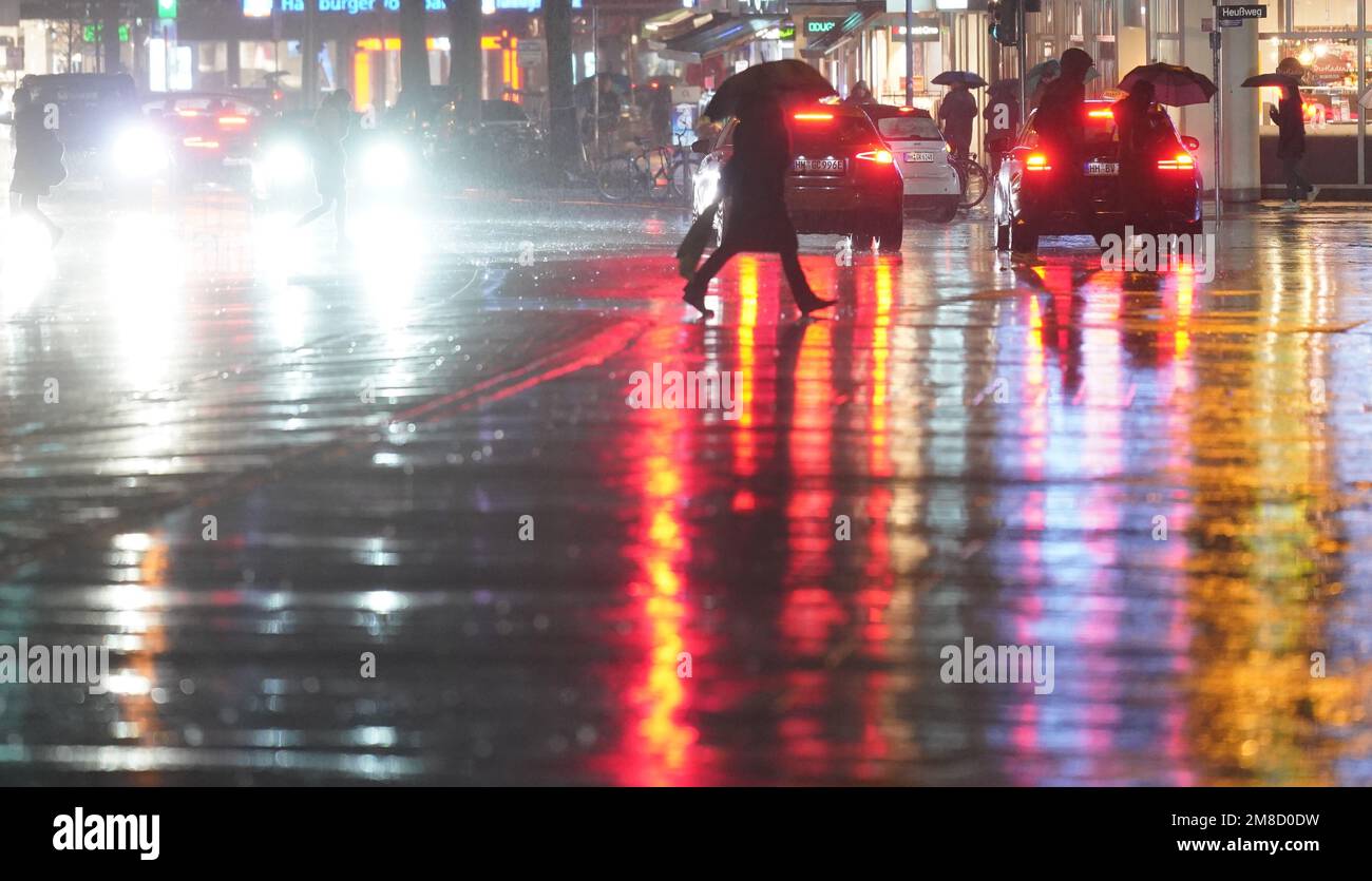 Hamburg, Germany. 13th Jan, 2023. Passers-by walk through an ...