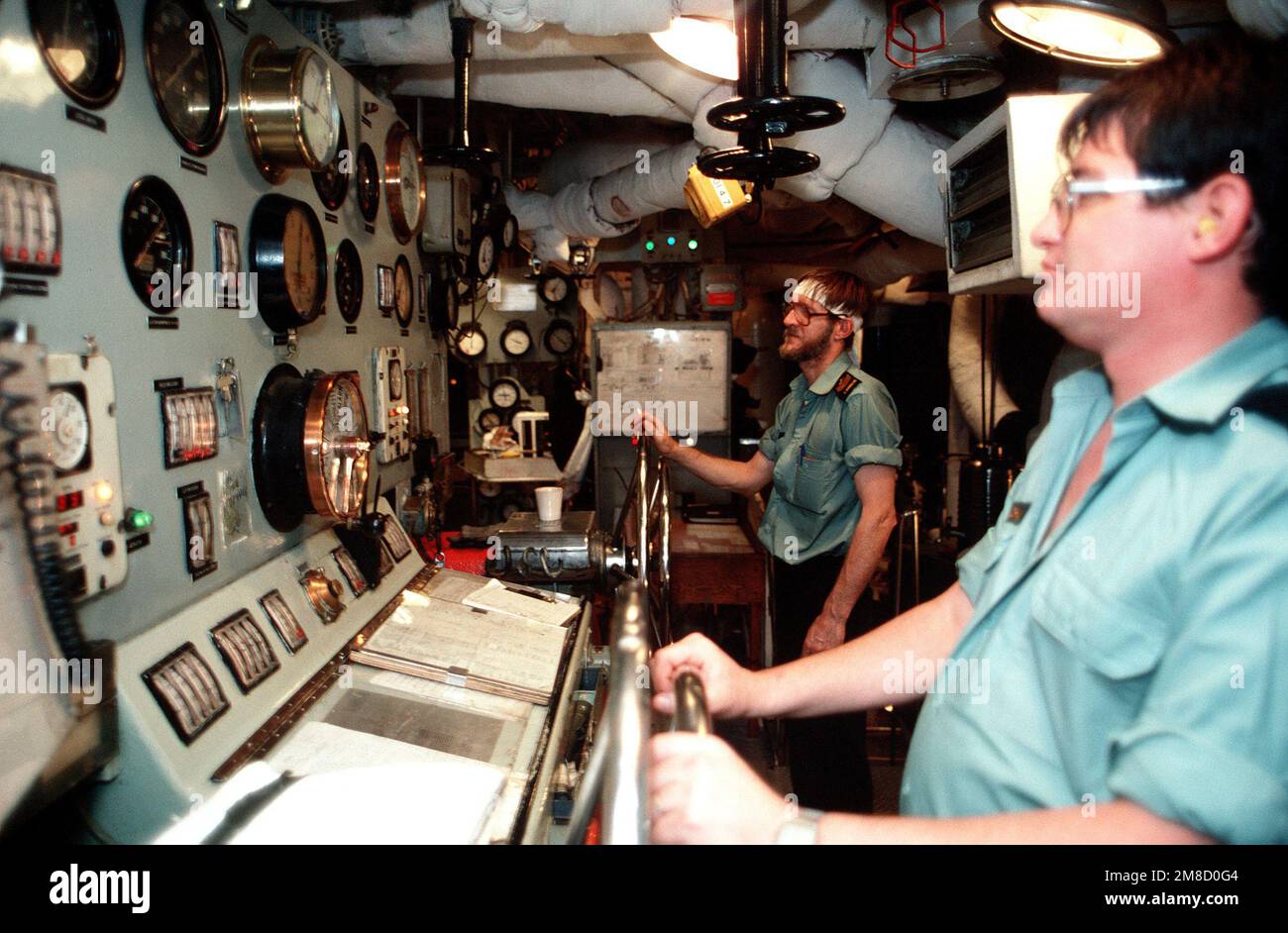 Sailors man their stations in an engineering space aboard the Canadian ...