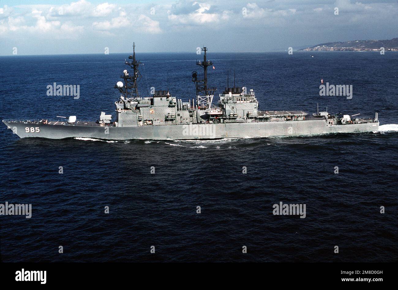 A port beam view of the destroyer USS CUSHING (DD-985) underway near ...