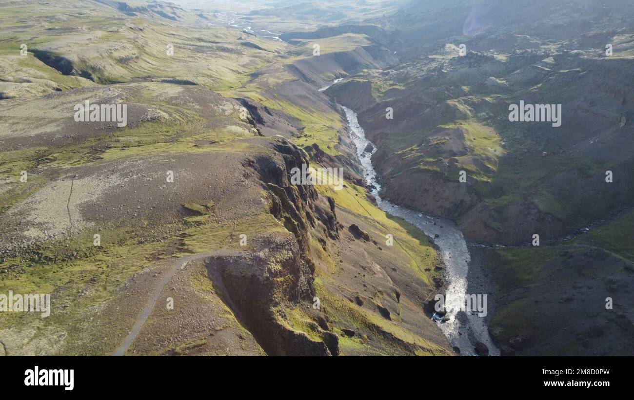 A Drone shot over Haifoss Waterfall in Iceland river Fossa on a sunny ...