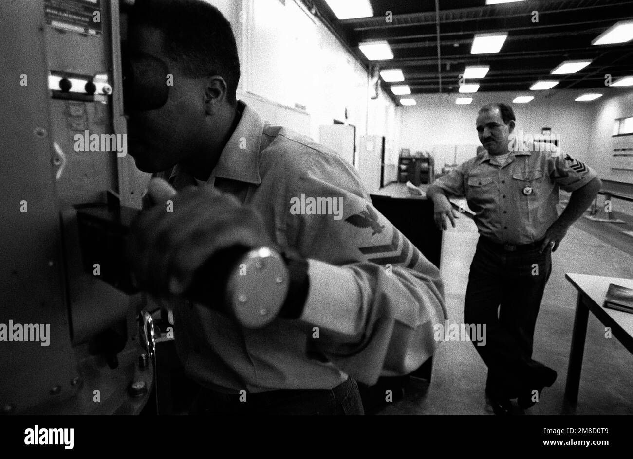 Opticalman 1ST Class Wayne Foust looks through a Type 18 periscope as Opticalman 1ST Class Jack ...