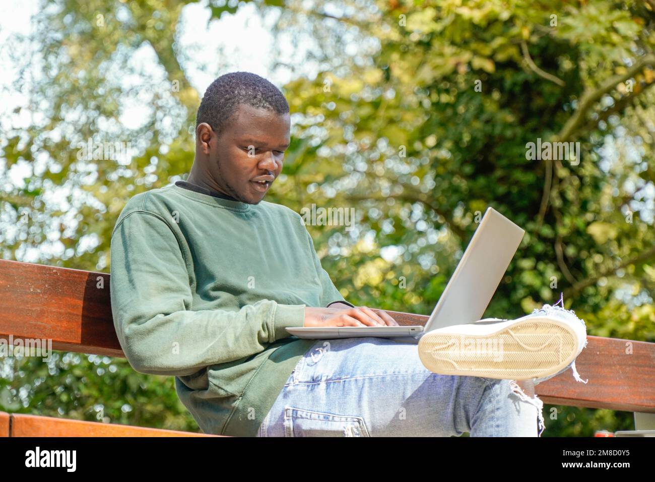boy from africa working with computer. black people Stock Photo - Alamy