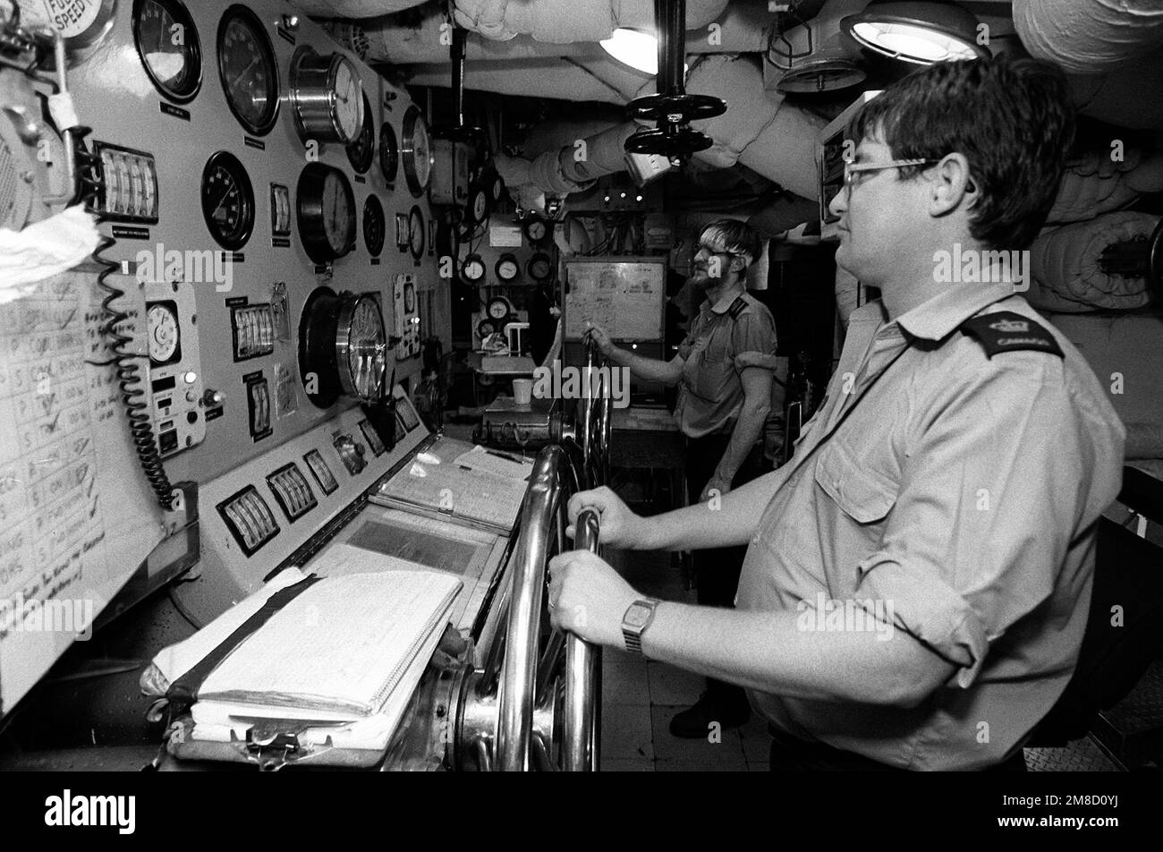 Sailors man their stations in an engineering space aboard the Canadian ...
