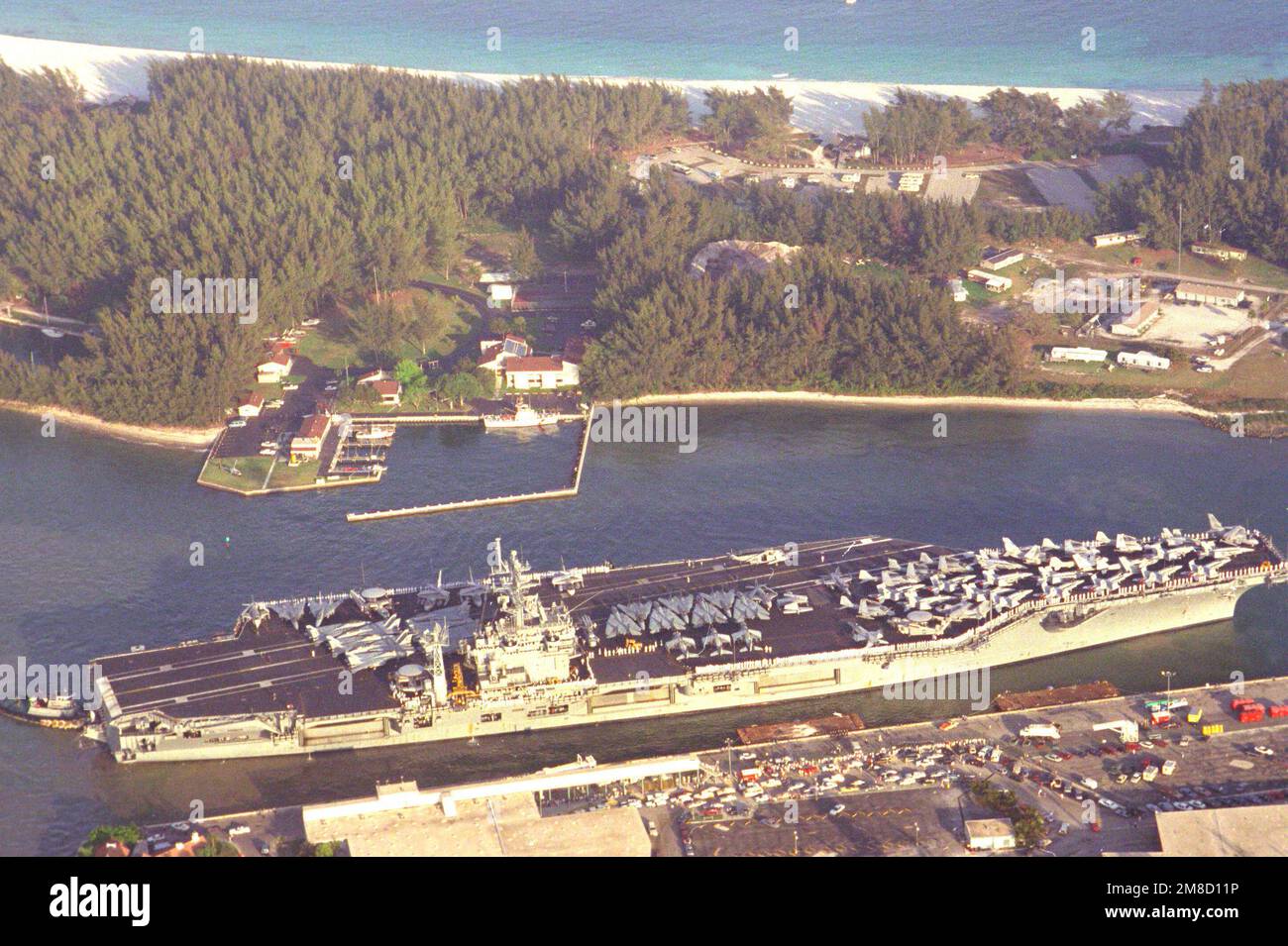 Various aircraft line the deck of the nuclear-powered aircraft carrier ...