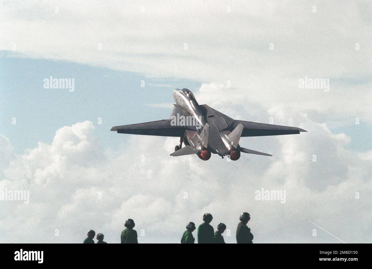 Trailing the tow wire for an aerial banner target, a Fighter Squadron ...