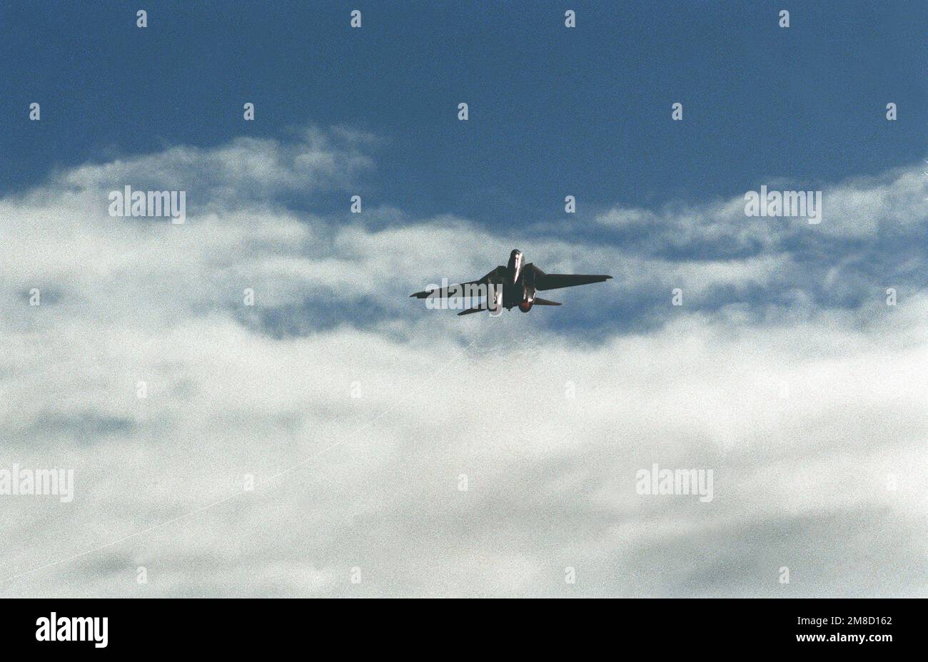 Trailing the tow wire for an aerial banner target, a Fighter Squadron ...