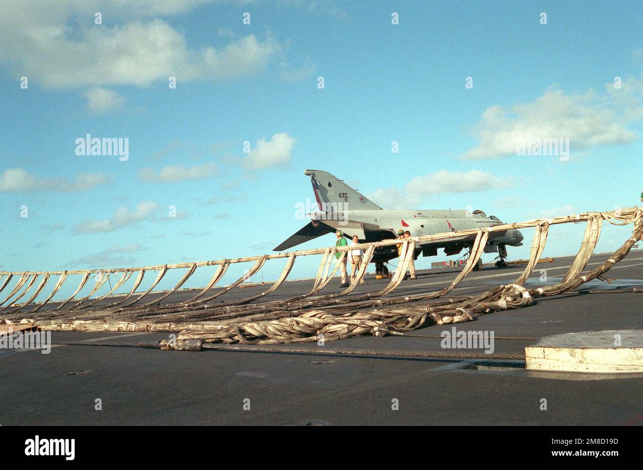 The crash barricade is lowered after a drill on the flight deck of the ...