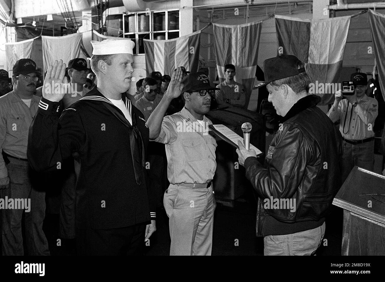 Secretary of the Navy H. Lawrence Garrett III administers the ...