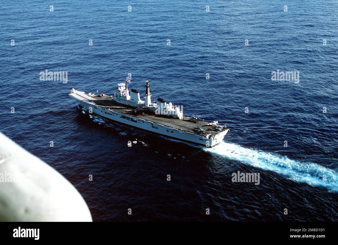 An aerial port quarter view of the British light aircraft carrier HMS ...