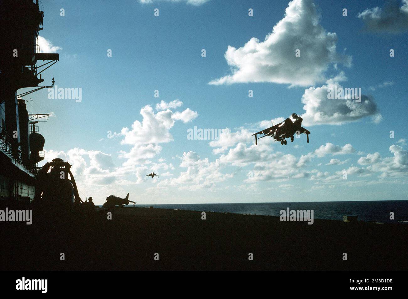 Two FRS. Mark 1 Sea Harrier aircraft come in to land aboard the light ...