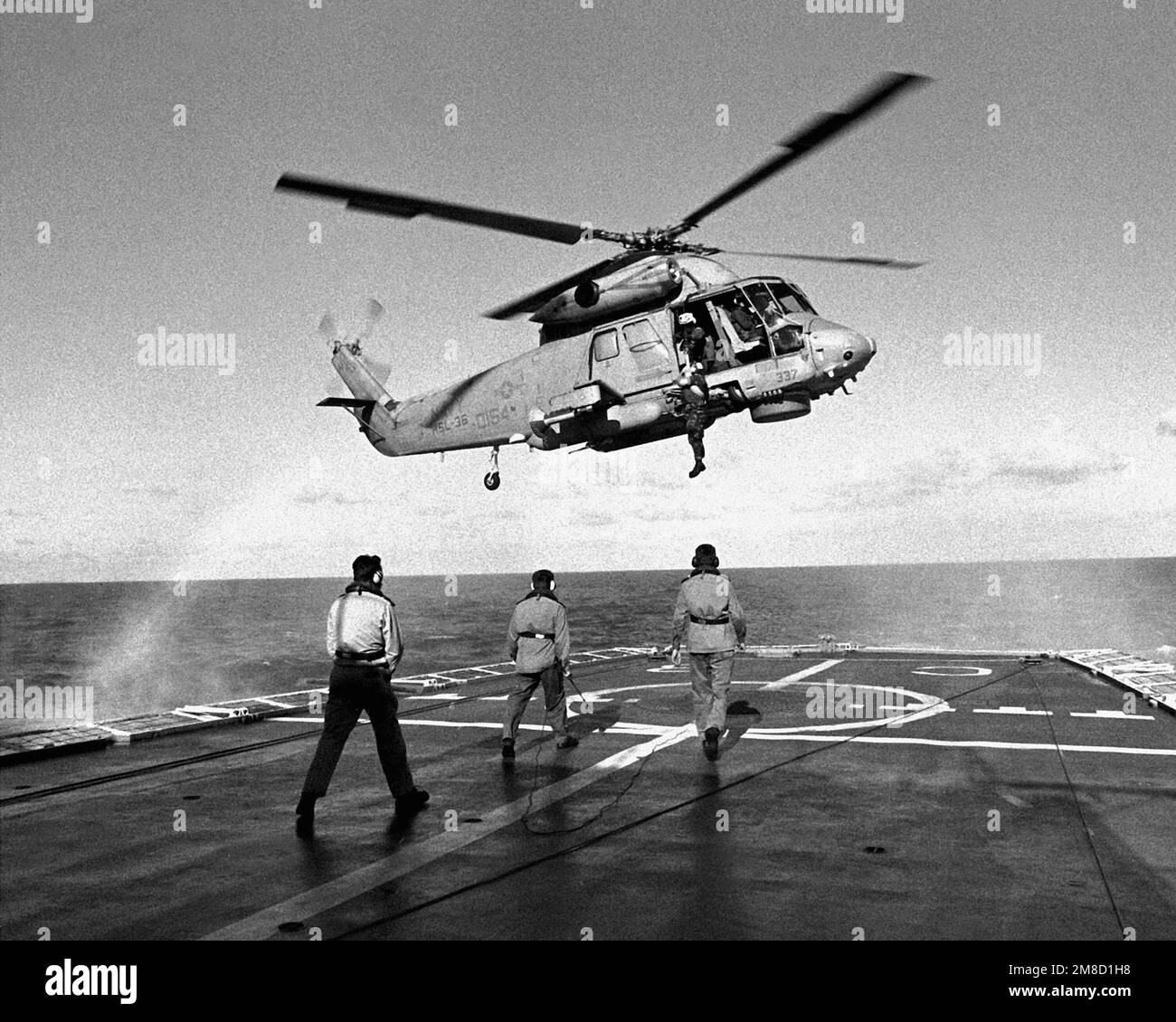 An American serviceman is lowered to the flight deck of the Dutch ...