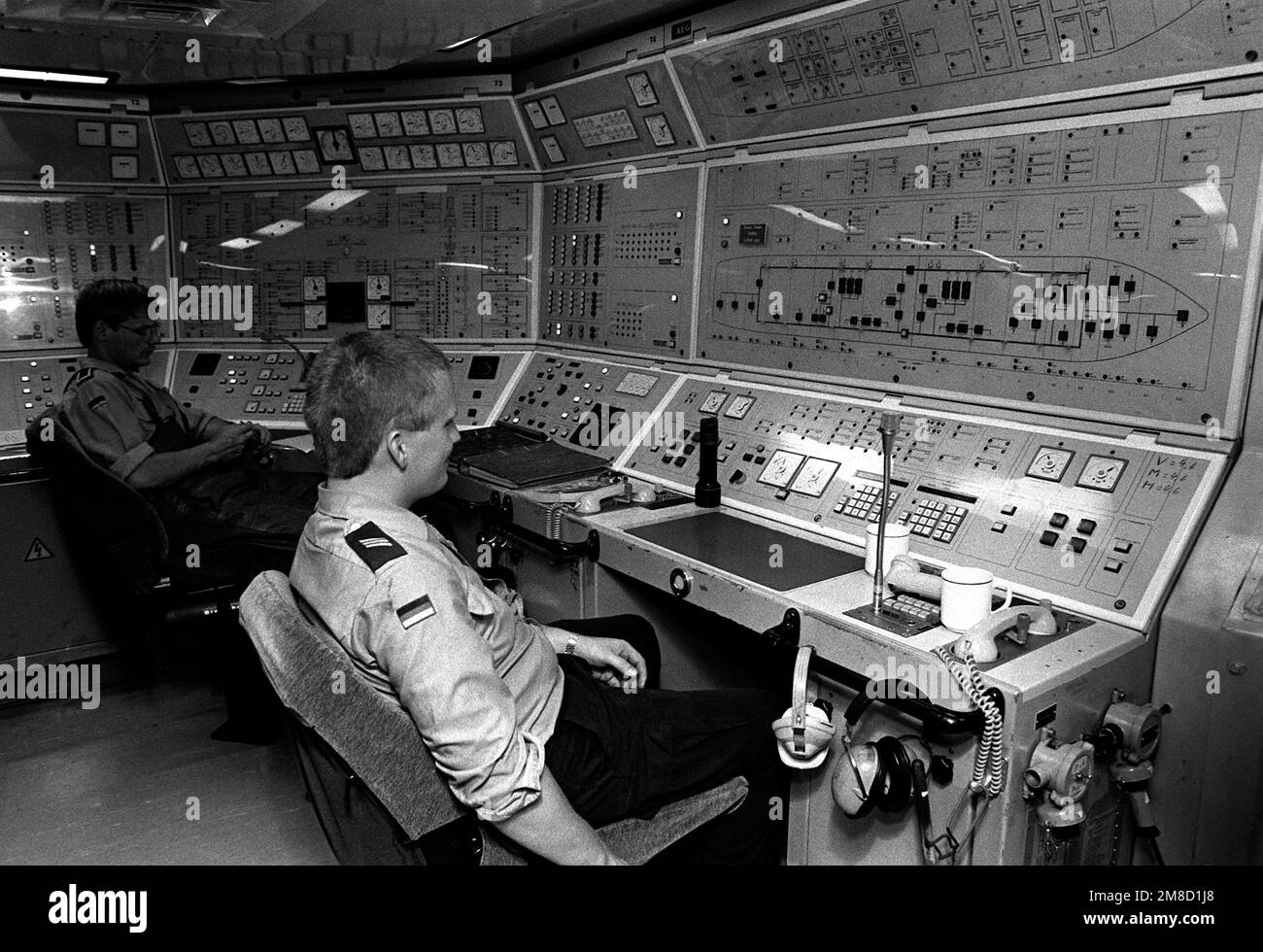 Sailors monitor some of the ship's systems from a control room in the ...