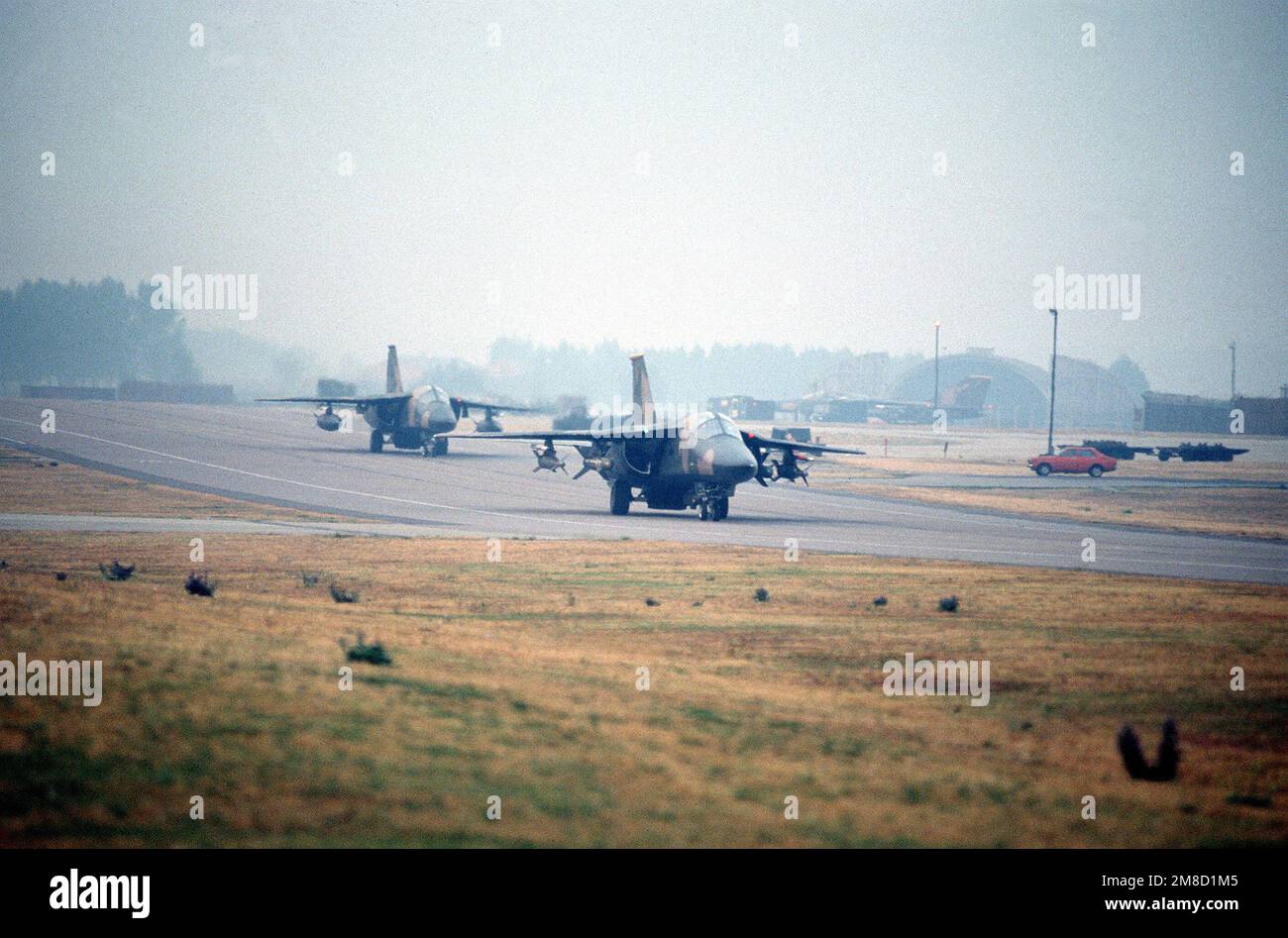 F-111F aircraft of the 48th Tactical Fighter Wing taxi to the flight ...