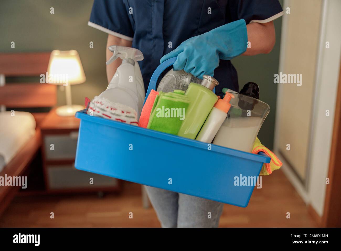 Woman holds box cleaning supplies hi-res stock photography and images ...