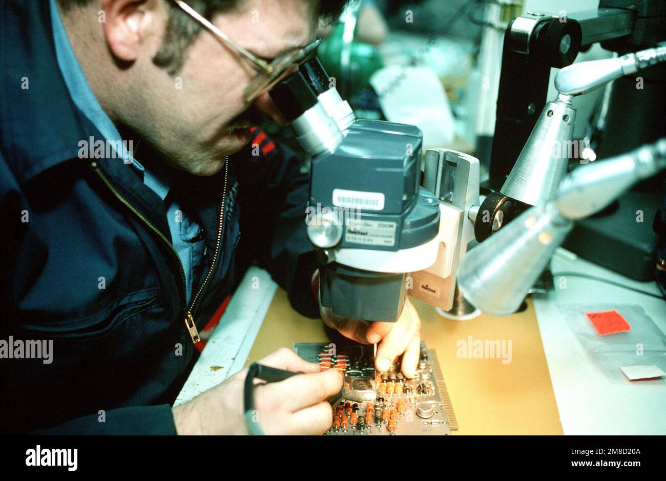 Aviation Fire Control Technician 1ST Class Gregory E. Timmons solders ...