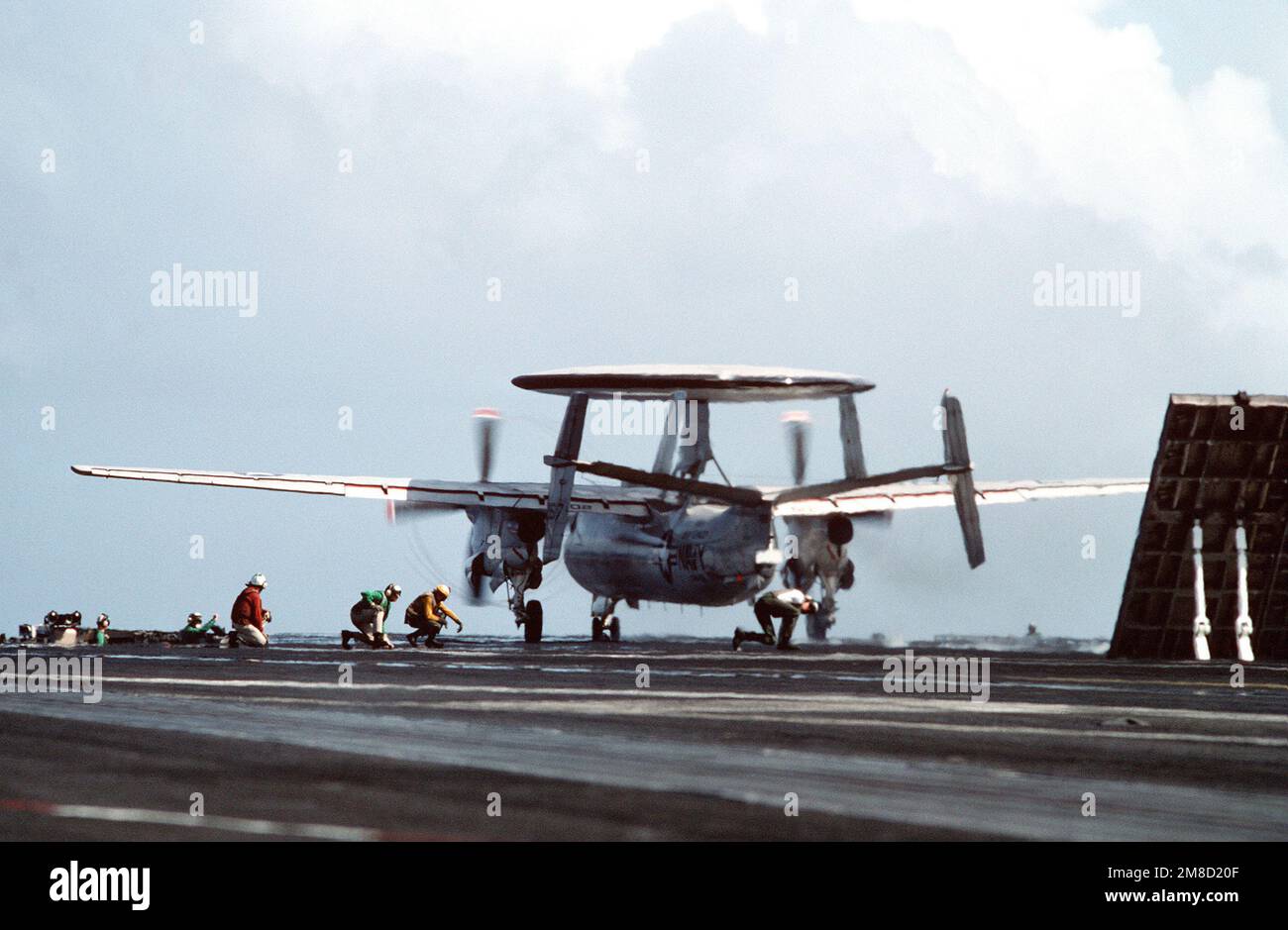 Catapult crewmen make a final check on an Airborne Early Warning ...