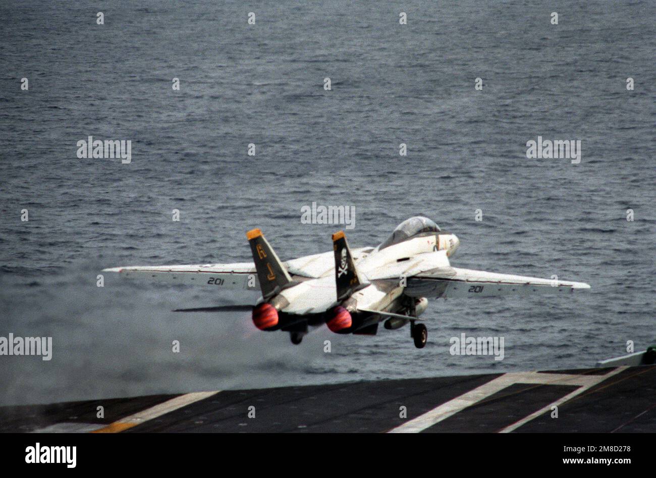 A Fighter Squadron 84 (VF-84) F-14A Tomcat aircraft takes to the air ...