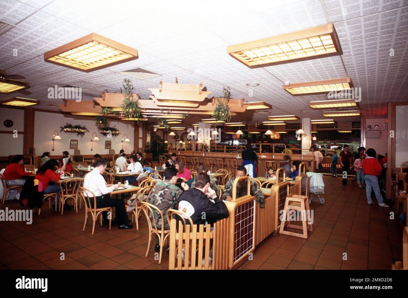 Employees eat at the Truman Plaza fast food concession, an Army/Air ...