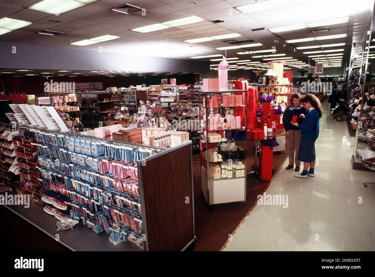 Customers select an item at the beauty products display in the Truman ...