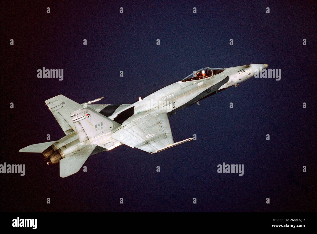 An air-to-air right side view of a Canadian 416th Tactical Fighter ...