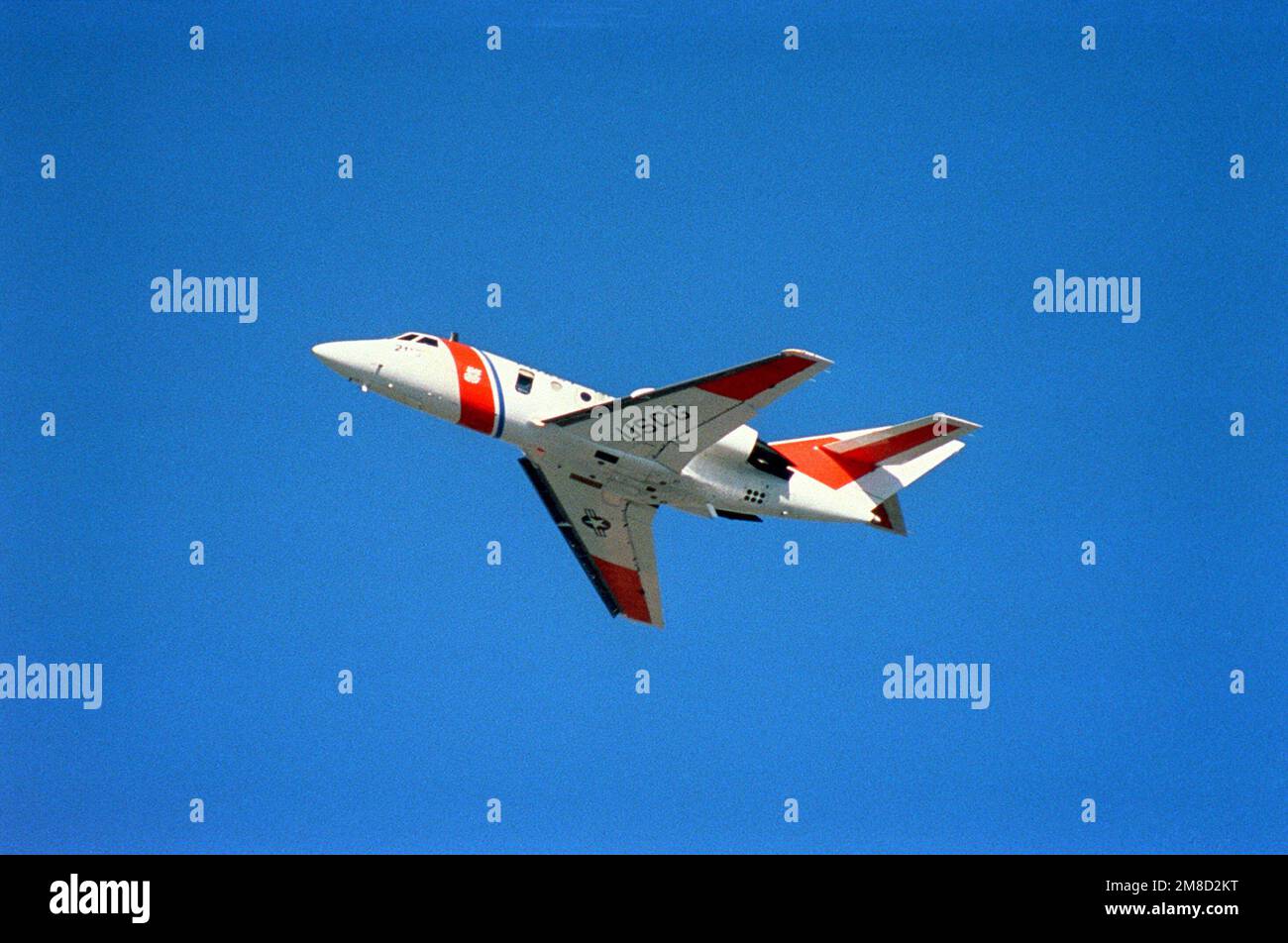 An air-to-air left underside view of a U.S. Coast Guard HU-25A Guardian ...