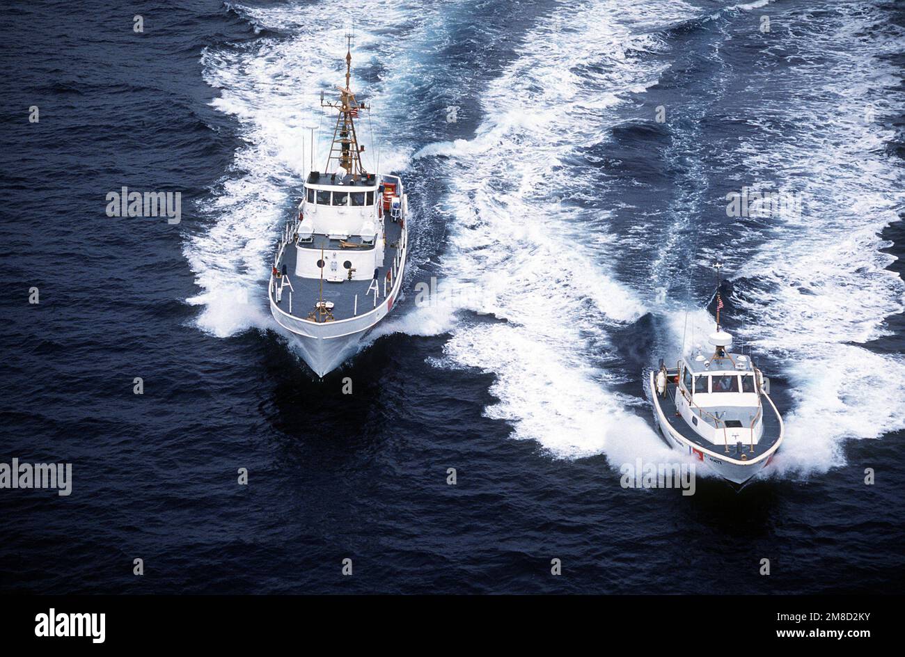 A 41-foot U.S. Coast Guard patrol boat passes the patrol boat USCGC ...