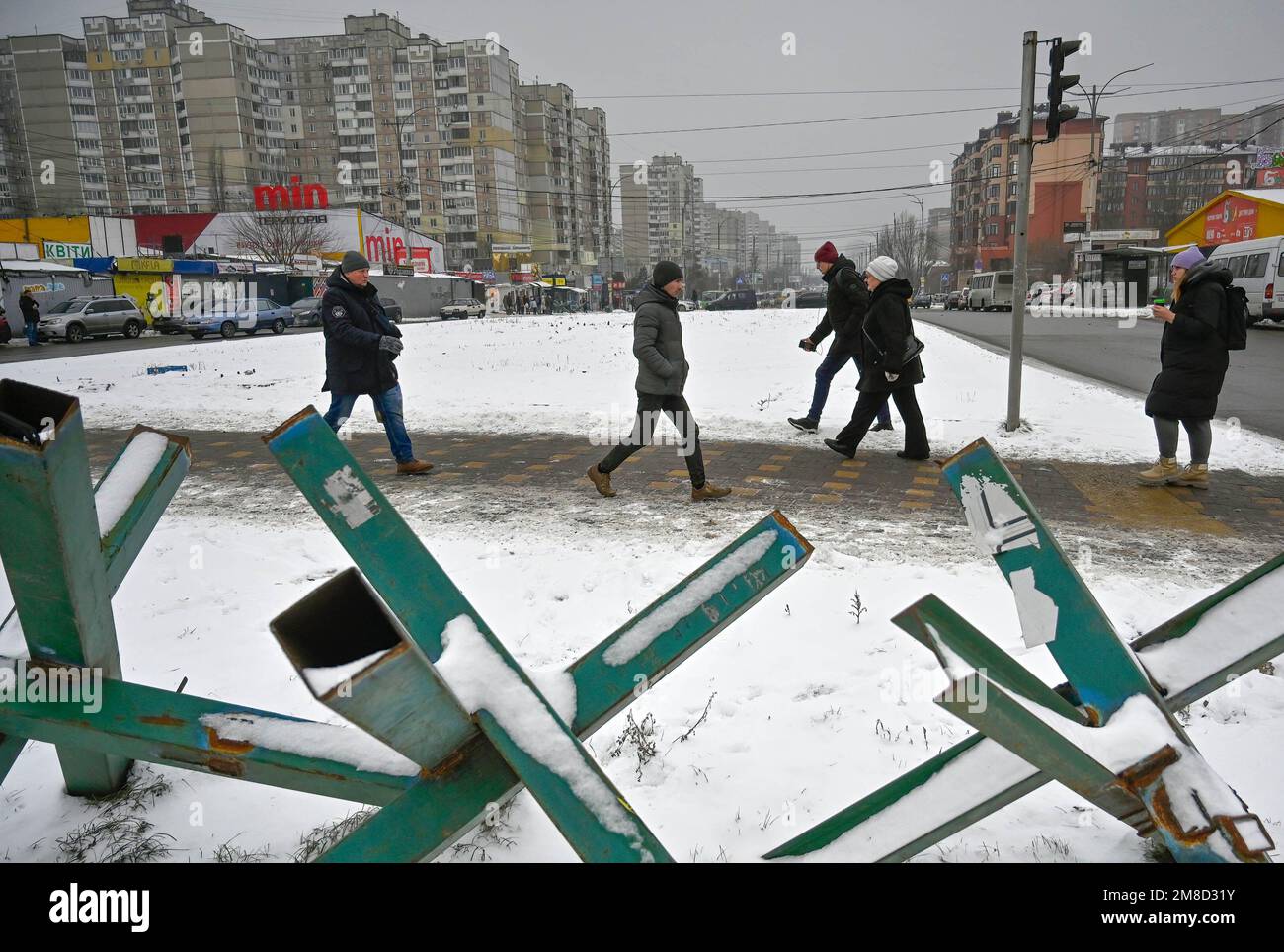 Kyiv, Ukraine. 12th Jan, 2023. People walk past anti-tank hedgehogs in ...
