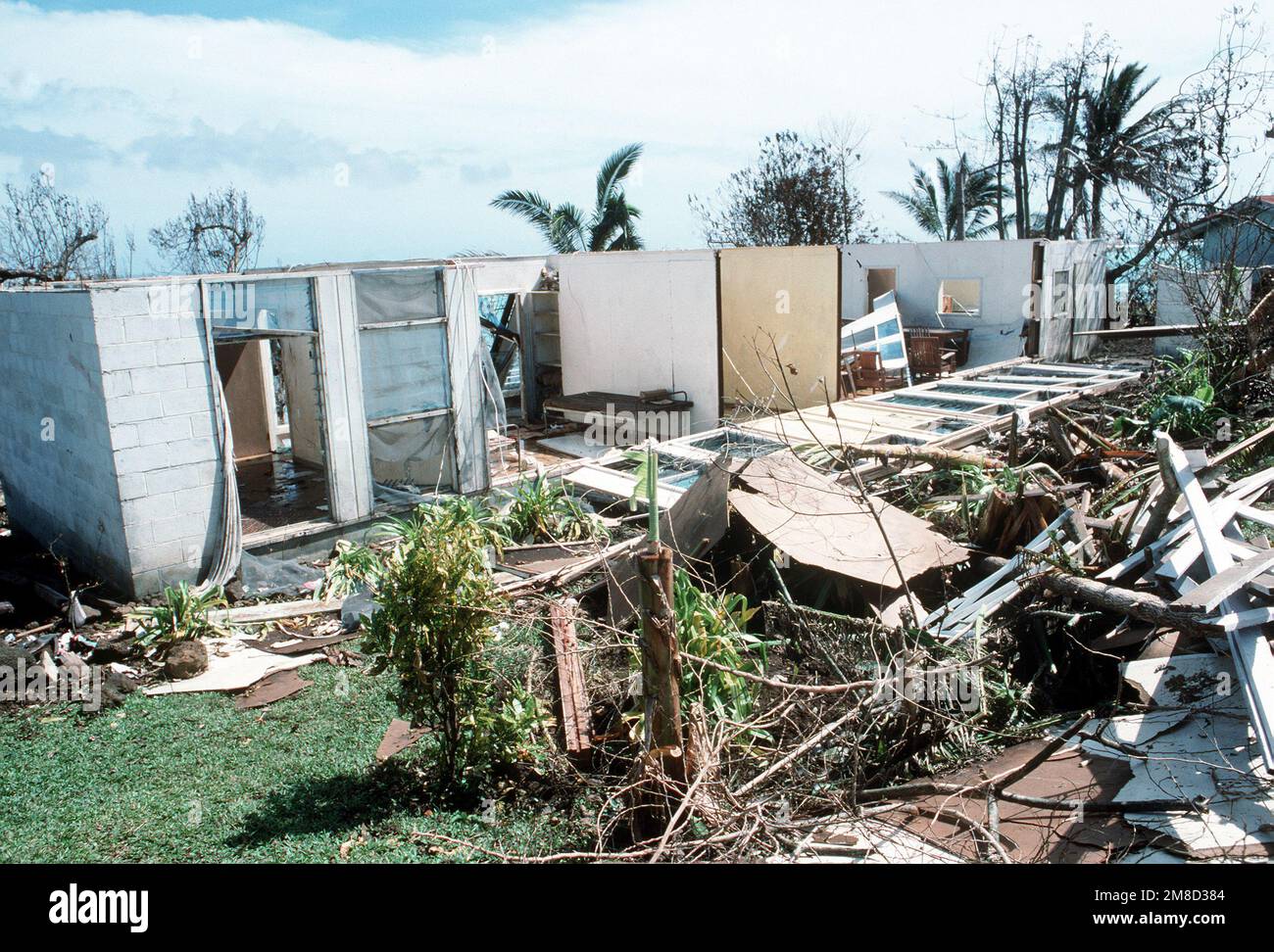 A demolished building displays the effects of Cyclone Ofa which struck ...