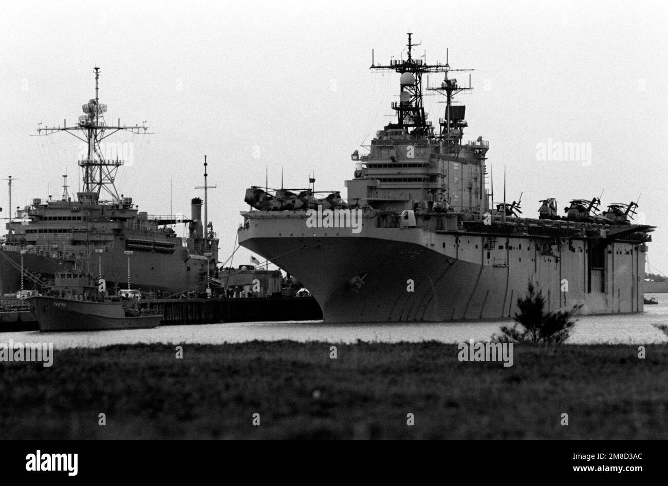 The amphibious transport dock USS DUBUQUE (LPD-8), left, and the ...