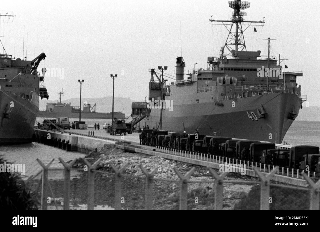 The dock landing ships USS ALAMO (LSD-33), left, and USS FORT FISHER ...