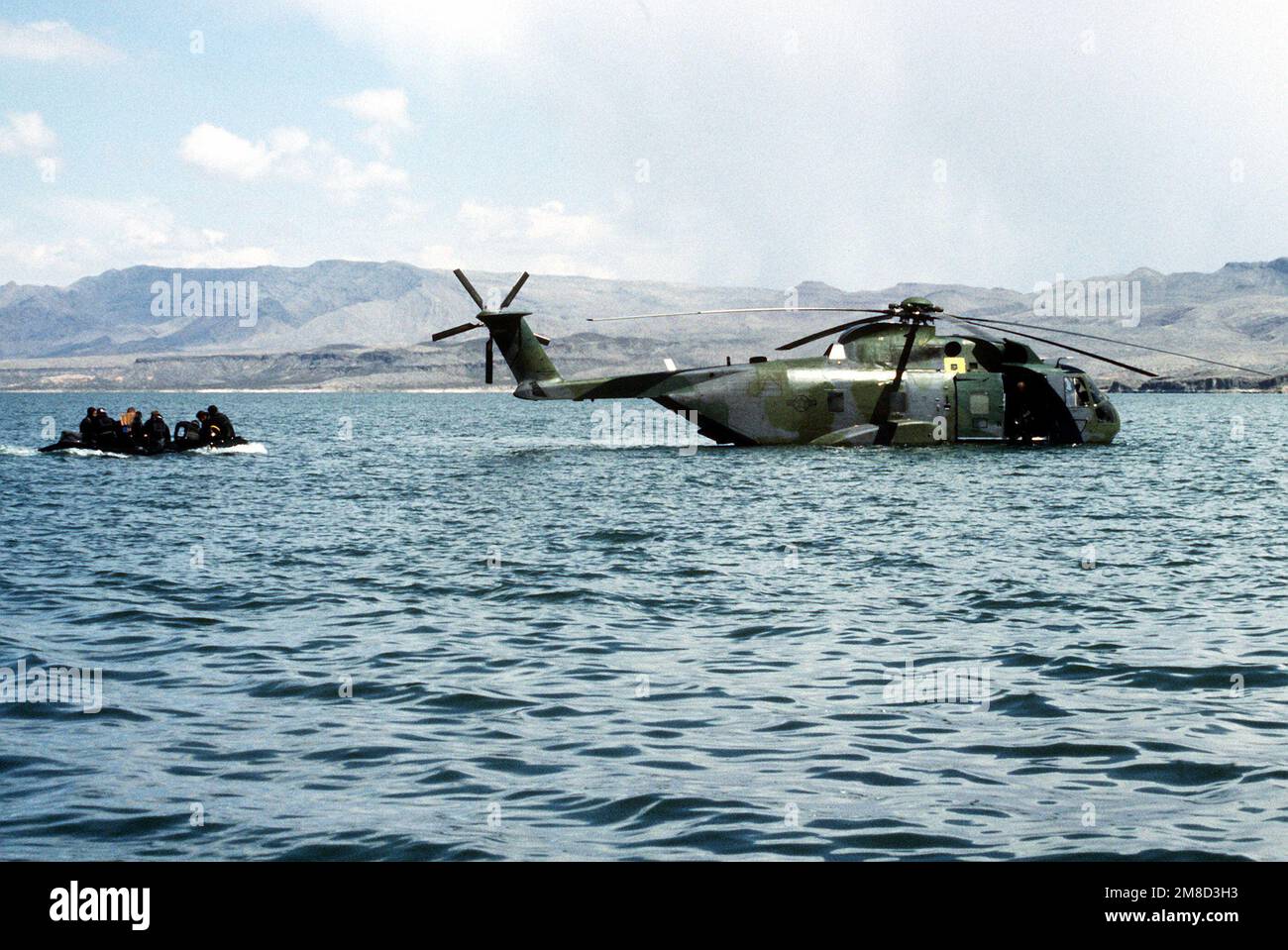 A CH-3E Sea King helicopter from the 1550th Combat Crew Training WinG floats on the surface of ...