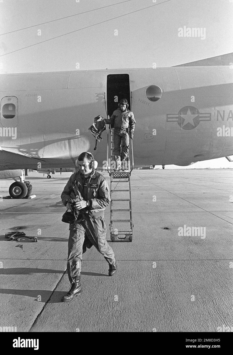 A member of Naval Air Reserve Patrol Squadron 66 (VP-66) disembarks a P ...