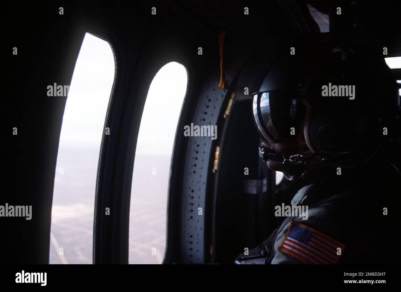 SSGT Kenneth Eaglin of the 1550th Combat Crew Training Wing, a flight engineer aboard a UH-60A ...