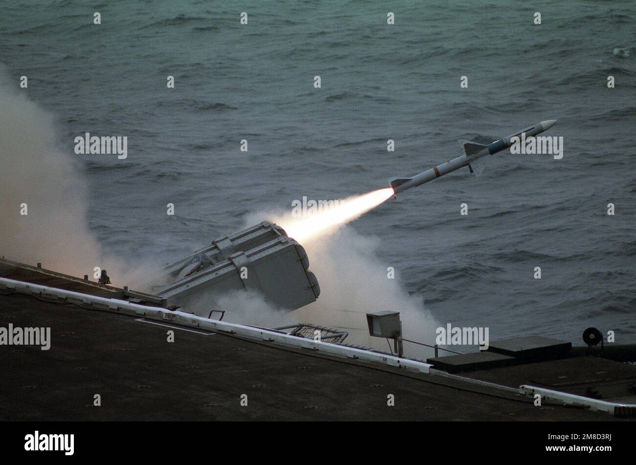A RIM-7 Sea Sparrow surface-to-air missile is fired from a Mark 29 NATO ...