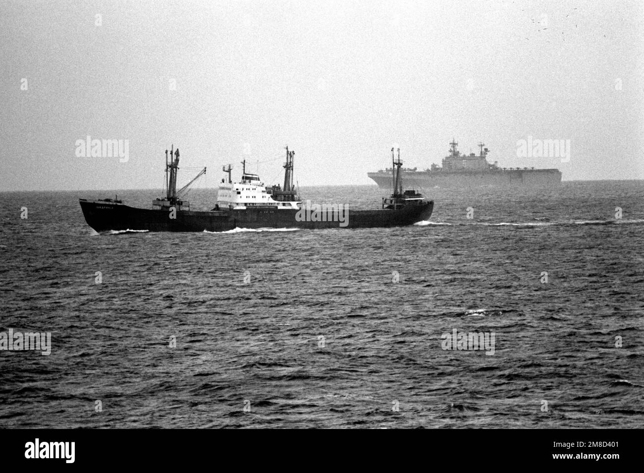 The Soviet merchant vessel SHADRINSK, foreground, and the amphibious ...