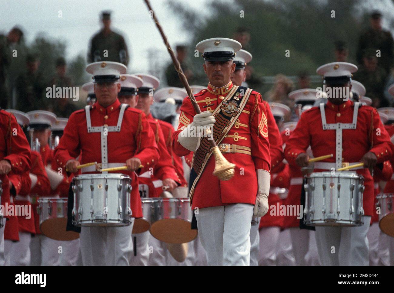 The drum major leads the members of the Marine Corps Drum and Bugle ...