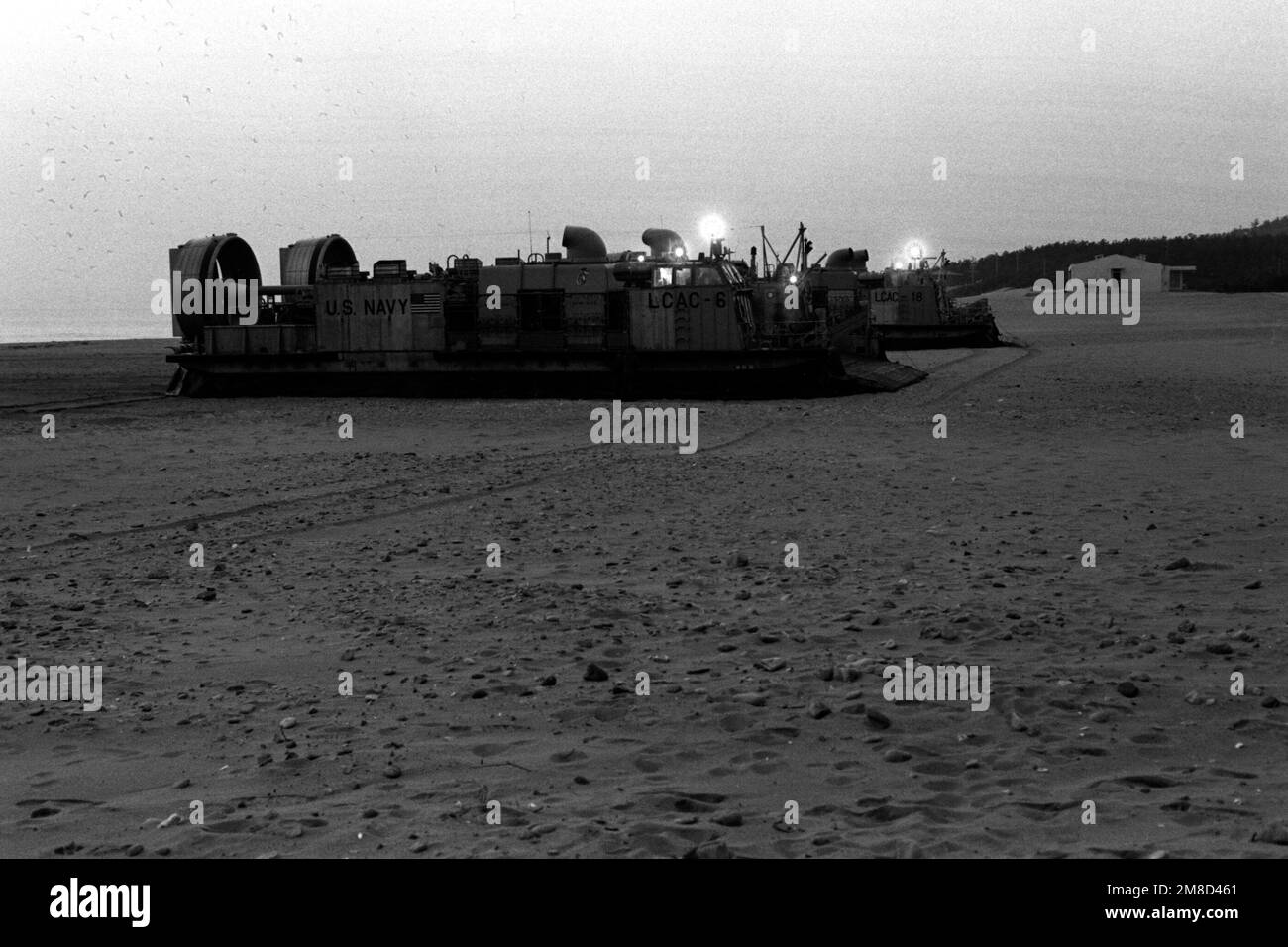 The air cushion landing craft LCAC-6, foreground, and LCAC-18 sit on ...