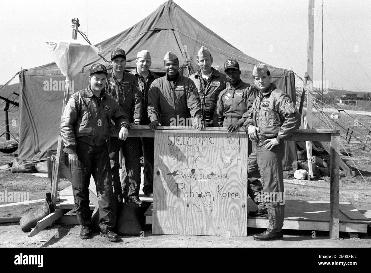 Members of a detachment from Patrol Squadron 22 (VP-22) gather around a ...