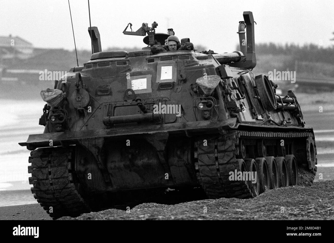 A Marine Corps M-88A1 armored recovery vehicle is driven along the ...