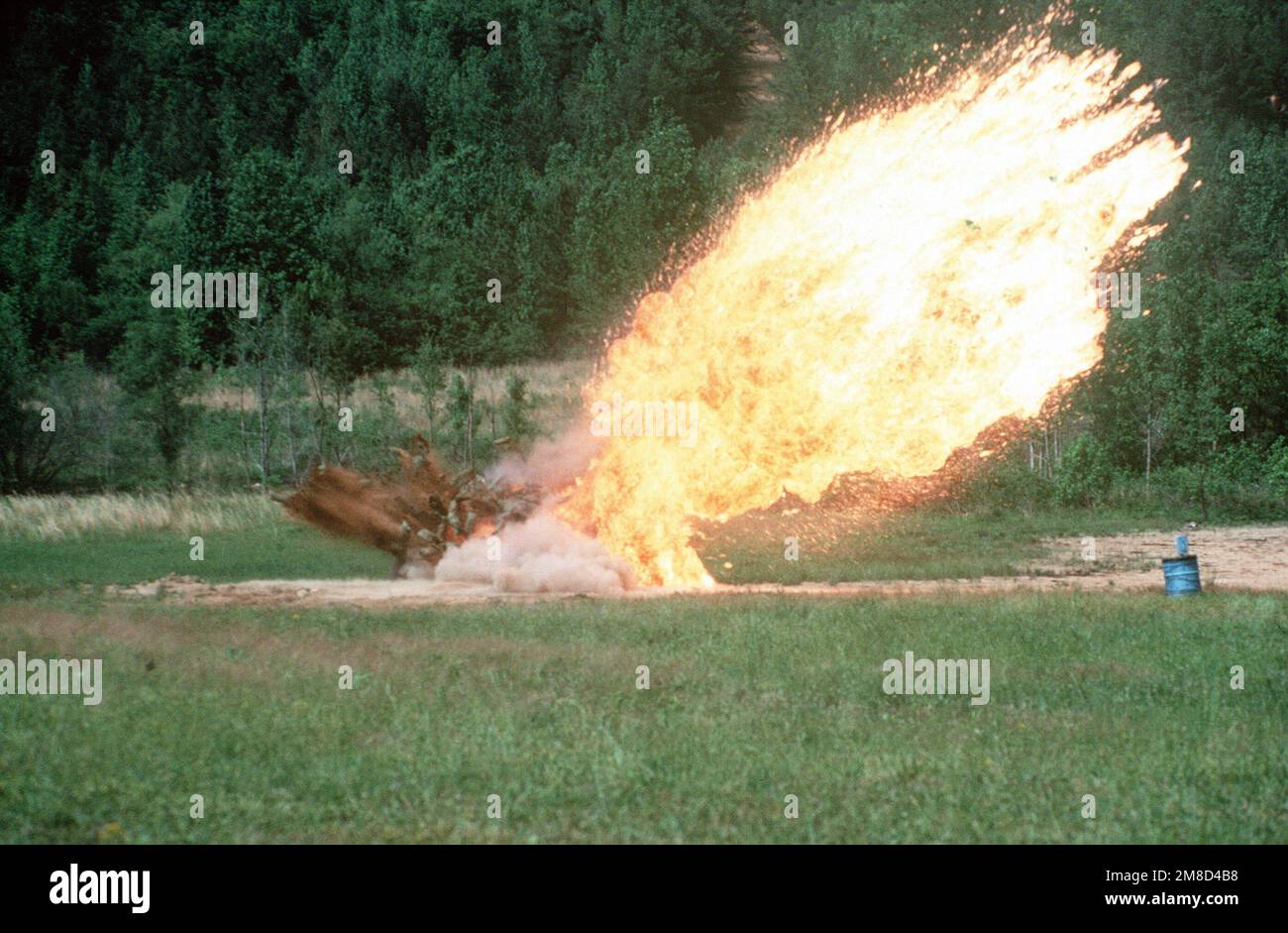 A wall of fire rises from a field flame expedient (FFX) produced in a ...