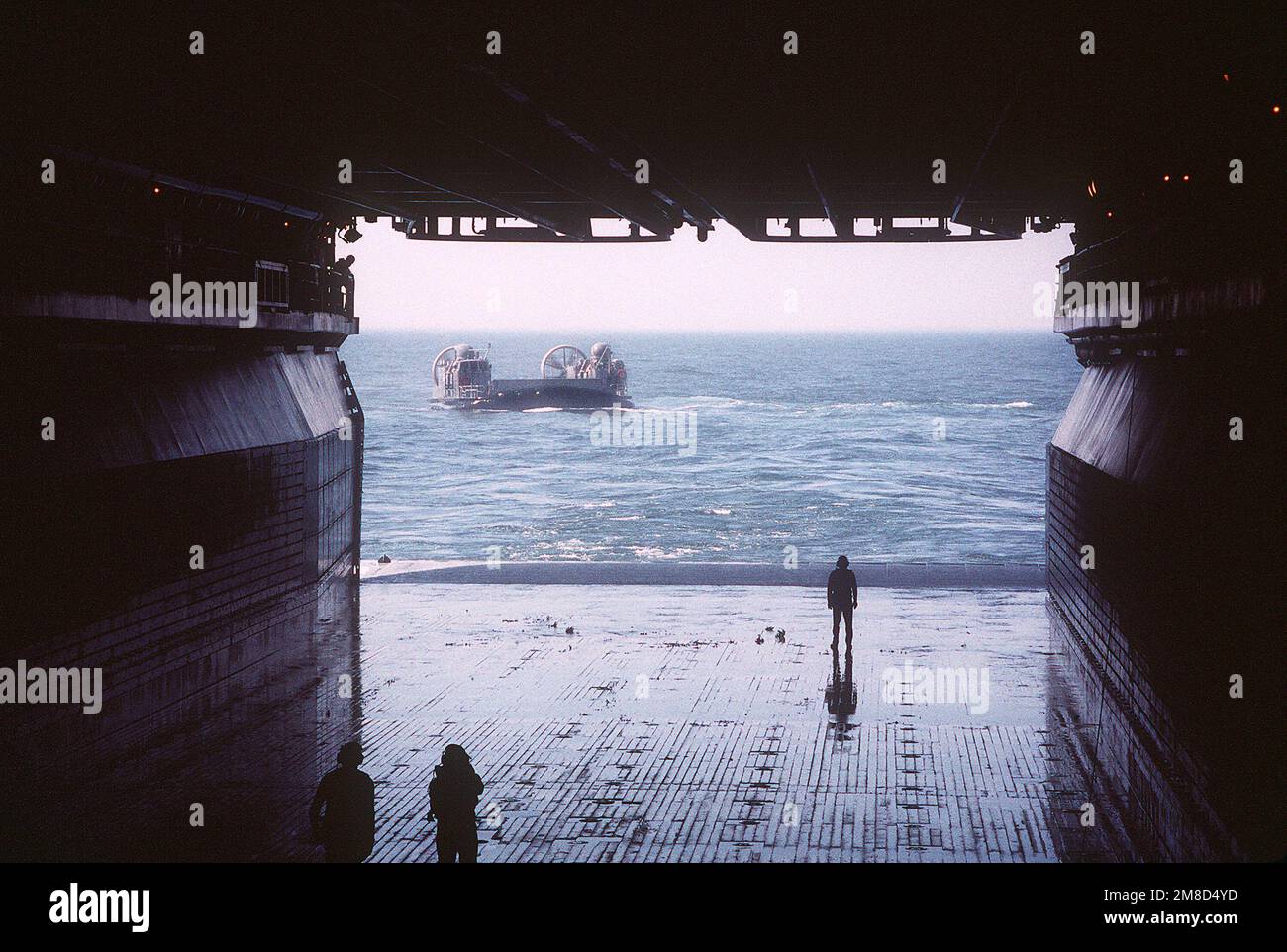 The air-cushion landing craft LCAC-15 approaches the well deck of the ...