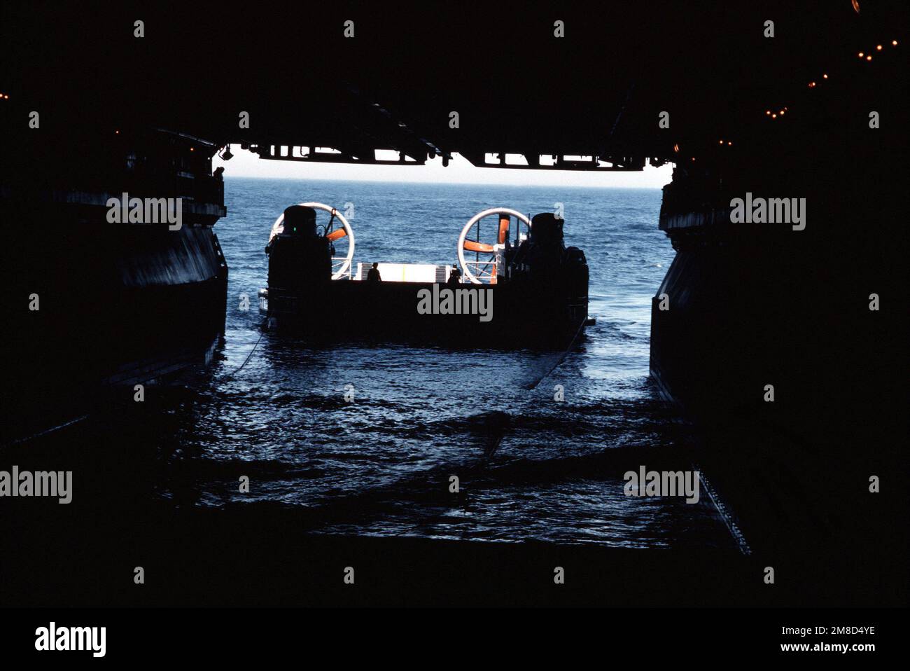 The air-cushion landing craft LCAC-15 prepares to enter the well deck ...