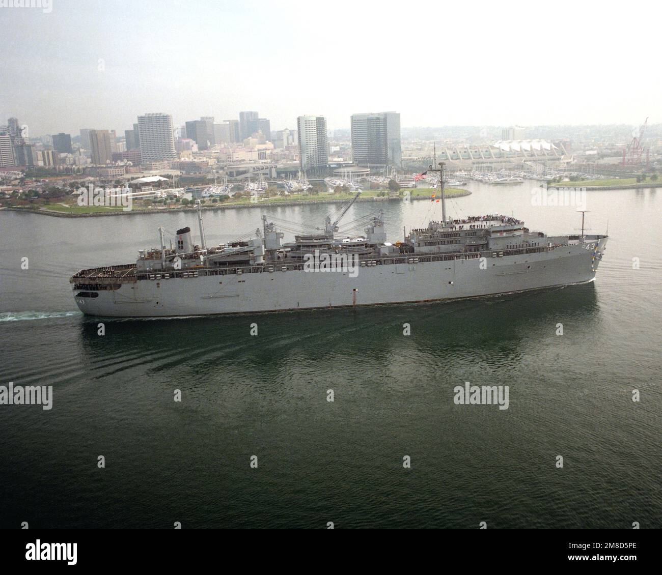 A starboard view of the destroyer tender USS CAPE COD (AD 43) entering ...